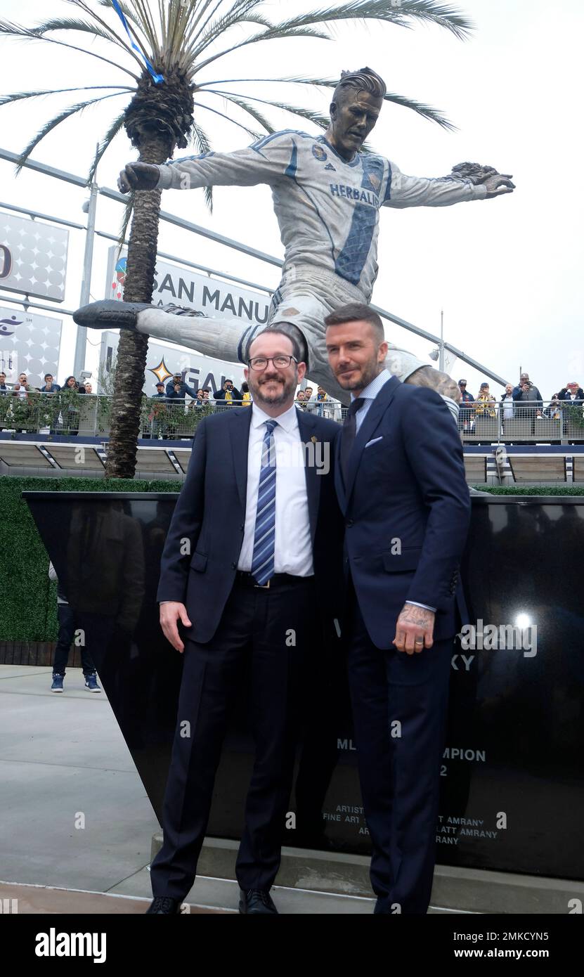 Dan Beckerman left, and David Beckham pose with the newly unveiled ...