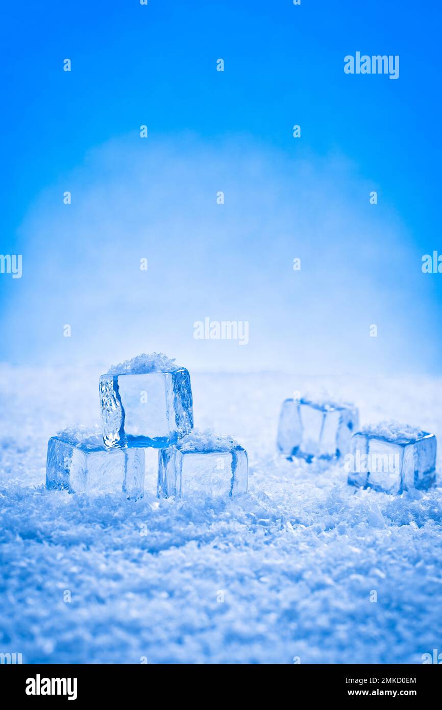 Cold ice cubes on the snow Stock Photo - Alamy