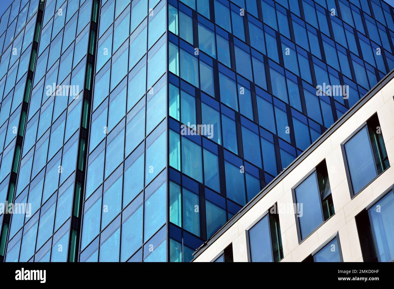 Abstract closeup of the glass-clad facade of a modern building covered ...