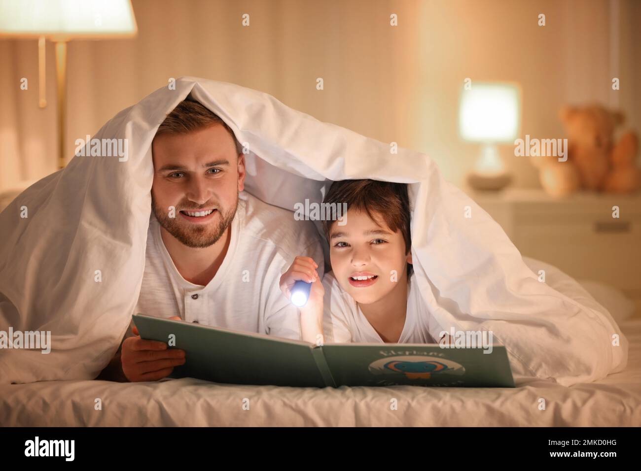 Child preteen flashlight bed hi-res stock photography and images - Alamy