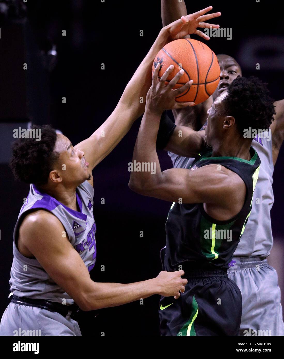 Kansas State guard Kamau Stokes, left, blocks a shot by Baylor guard ...