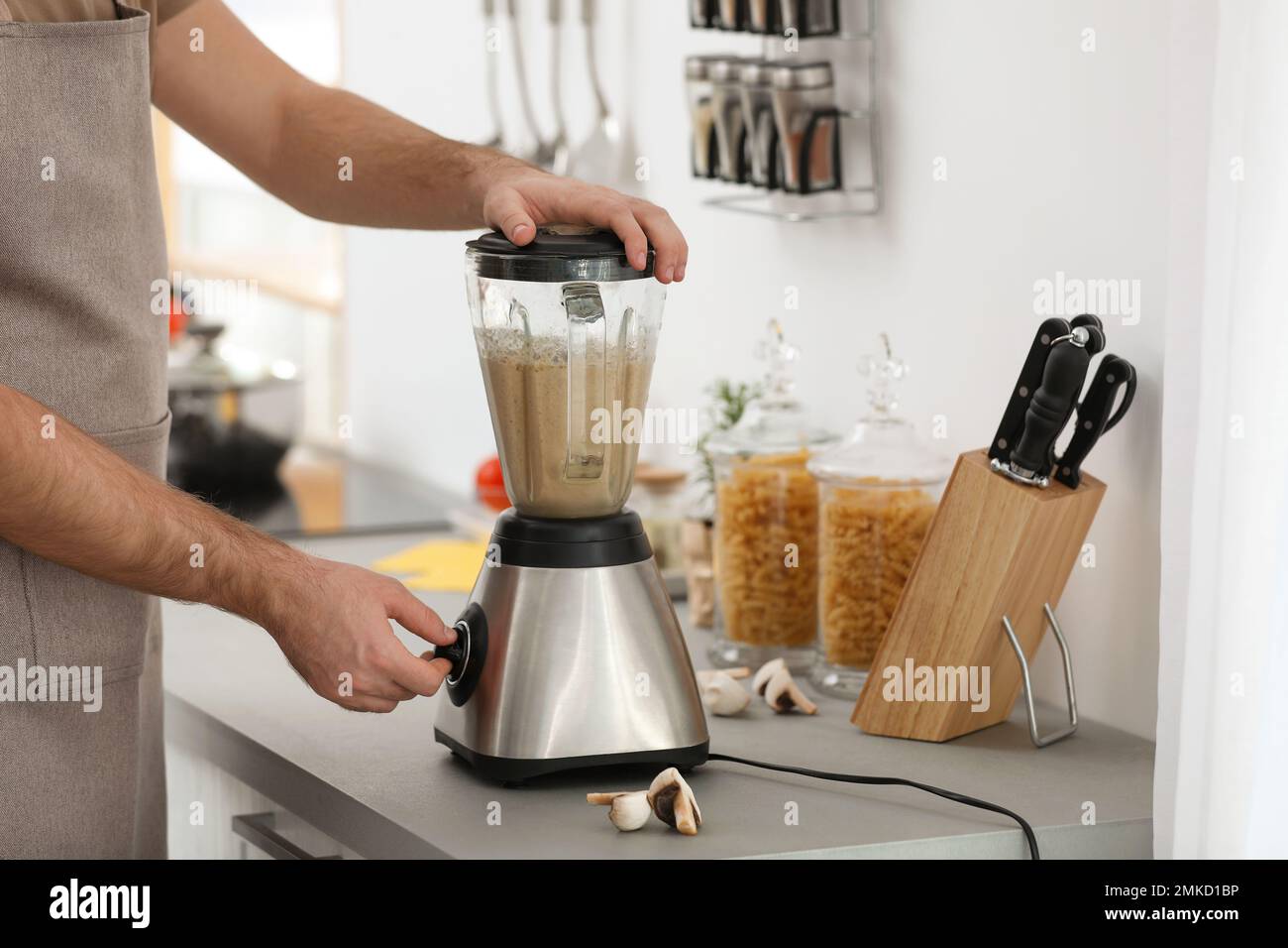 Man using blender in kitchen hi-res stock photography and images - Alamy