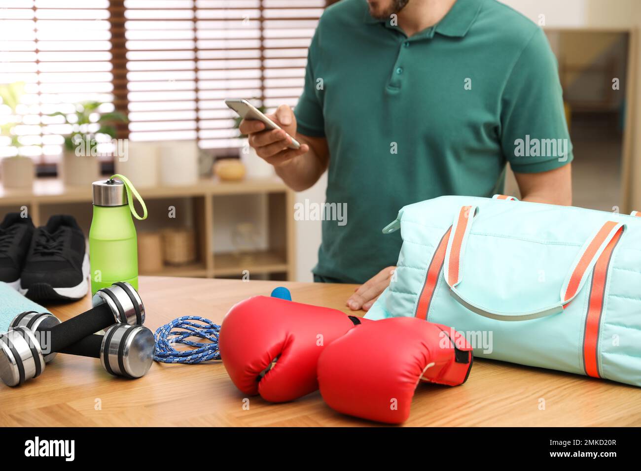 Man packing sports bag hi-res stock photography and images - Alamy