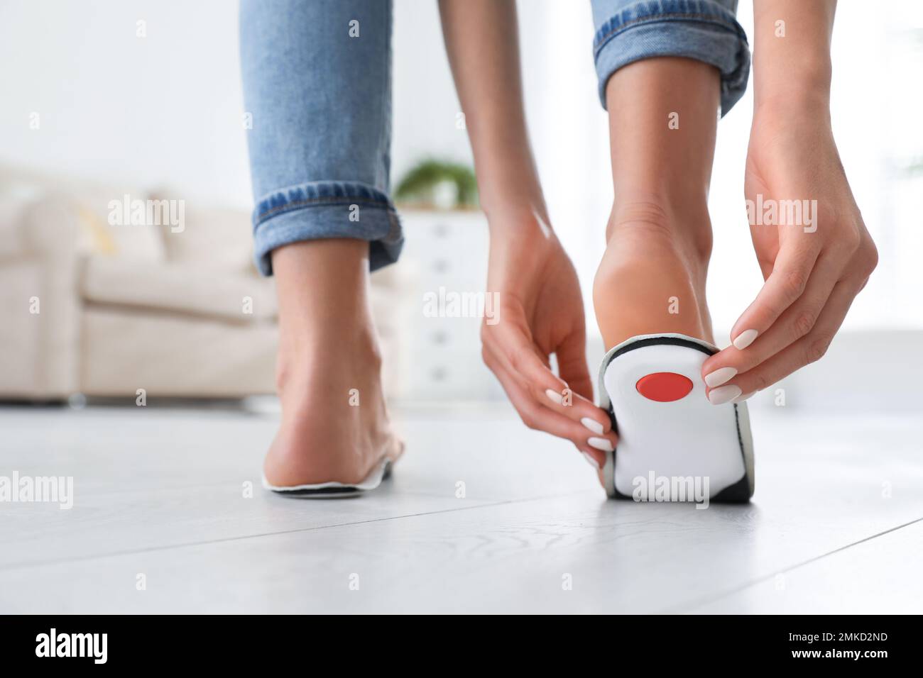 Woman fitting orthopedic insole hi-res stock photography and images - Alamy