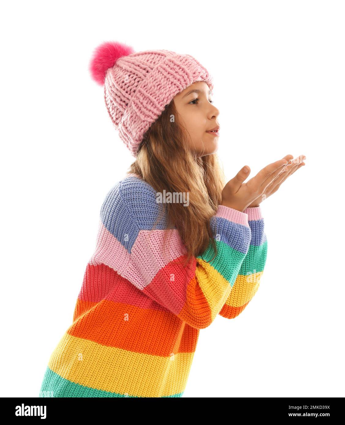 Cute little girl in warm clothes on white background. Winter vacation ...