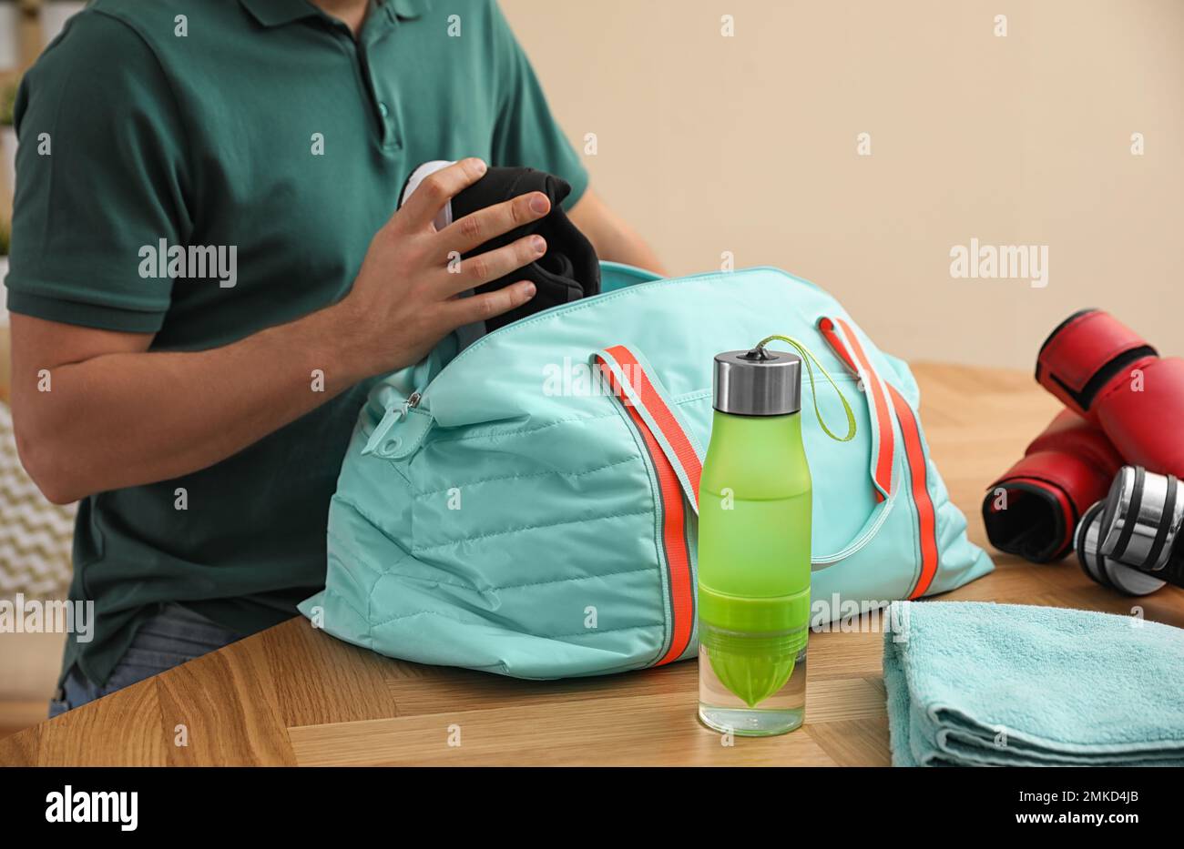Man packing sports bag hi-res stock photography and images - Alamy