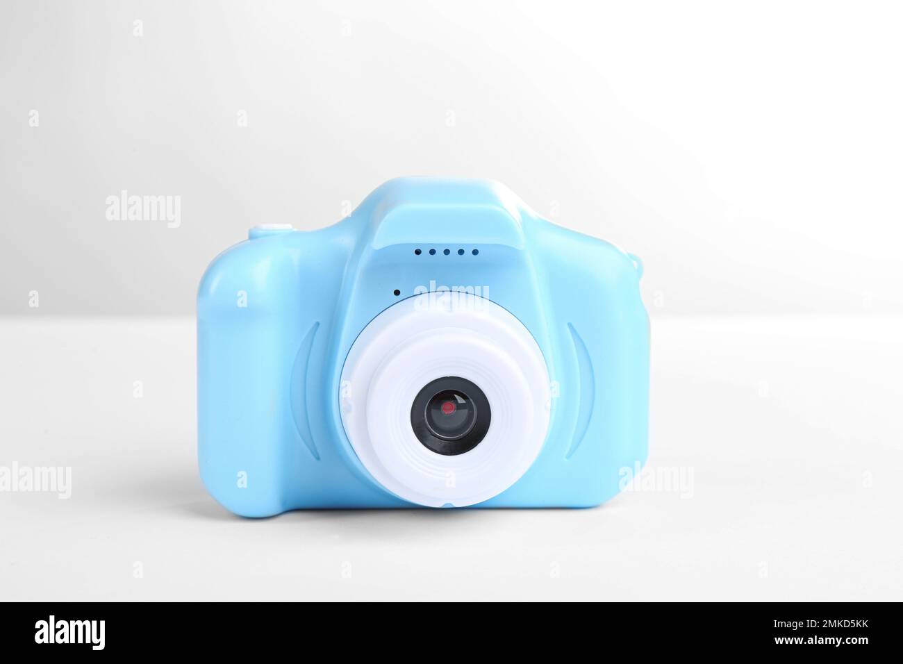 Light blue toy camera isolated on white Stock Photo - Alamy