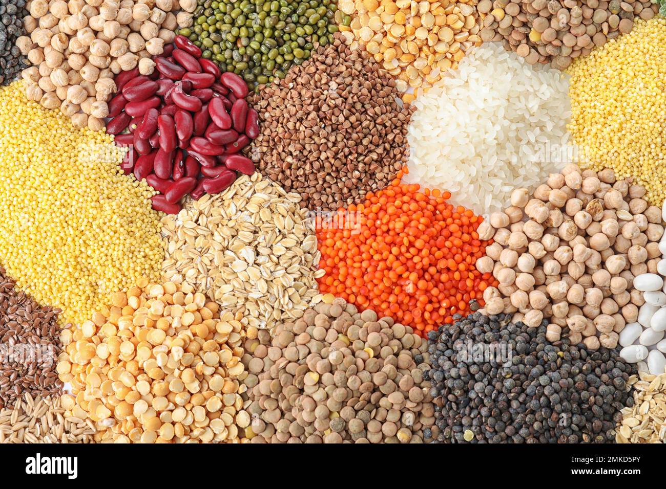 Different types of legumes and cereals as background, top view. Organic ...