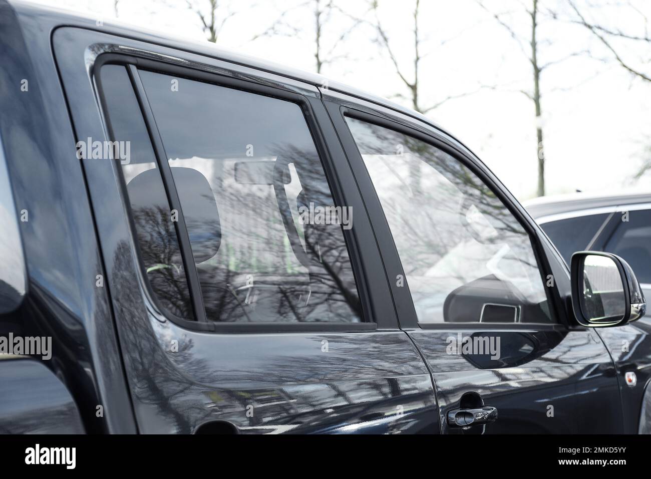 Modern car with tinting foil on window outdoors, closeup Stock Photo ...