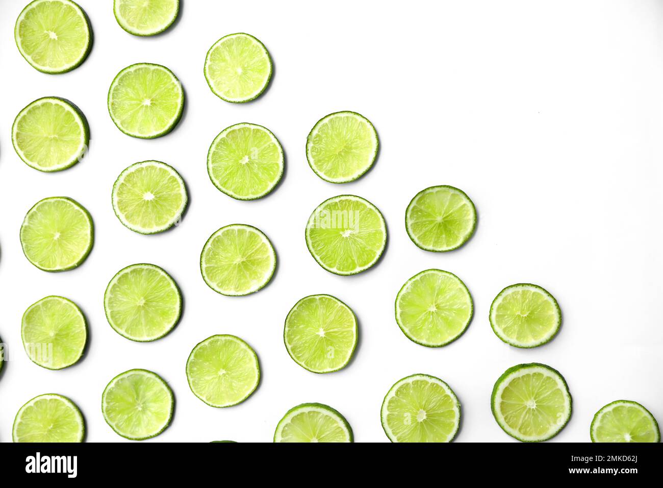 Slices of fresh juicy limes on white background, flat lay Stock Photo - Alamy
