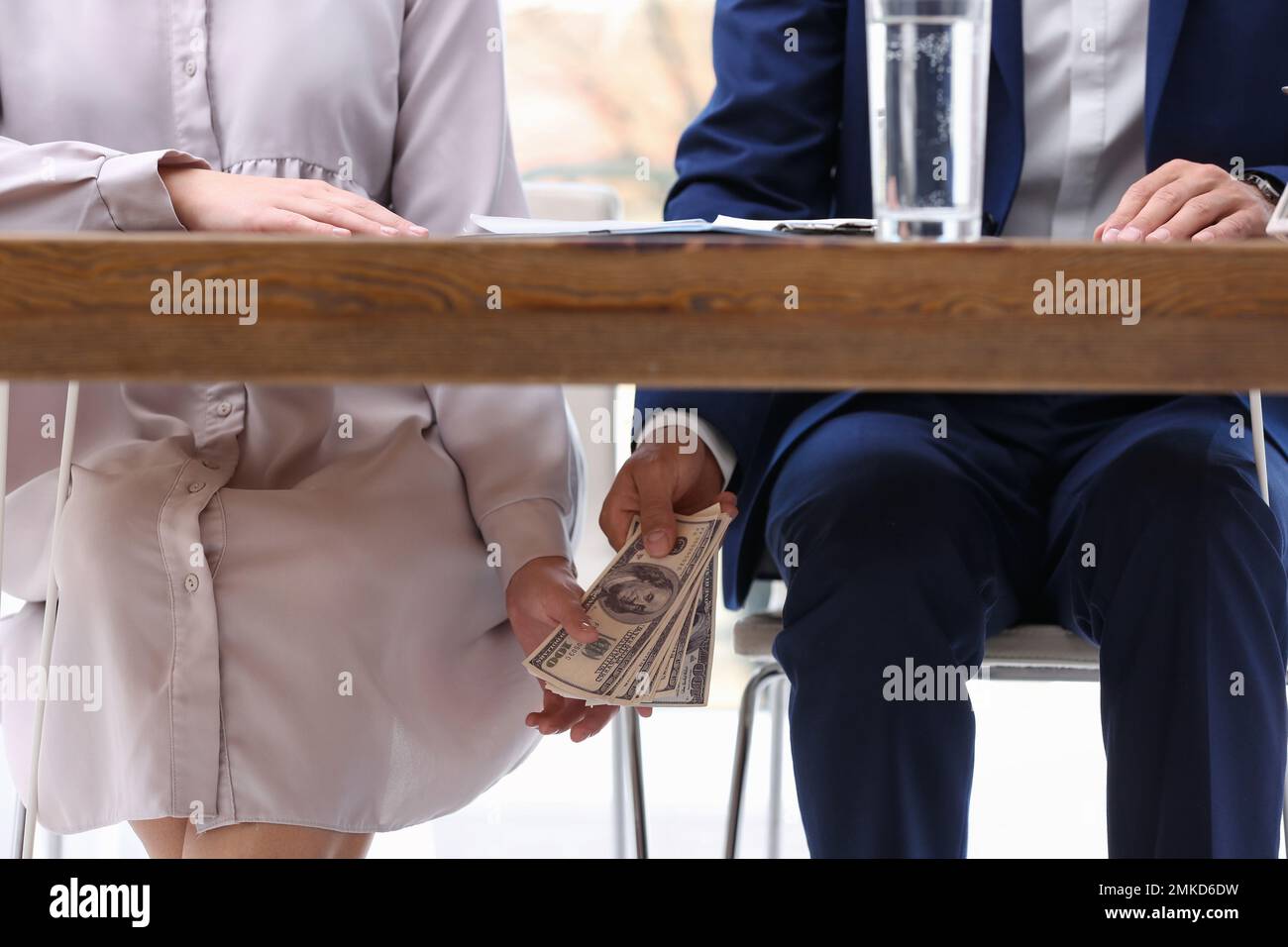 Money under the table hi-res stock photography and images - Alamy