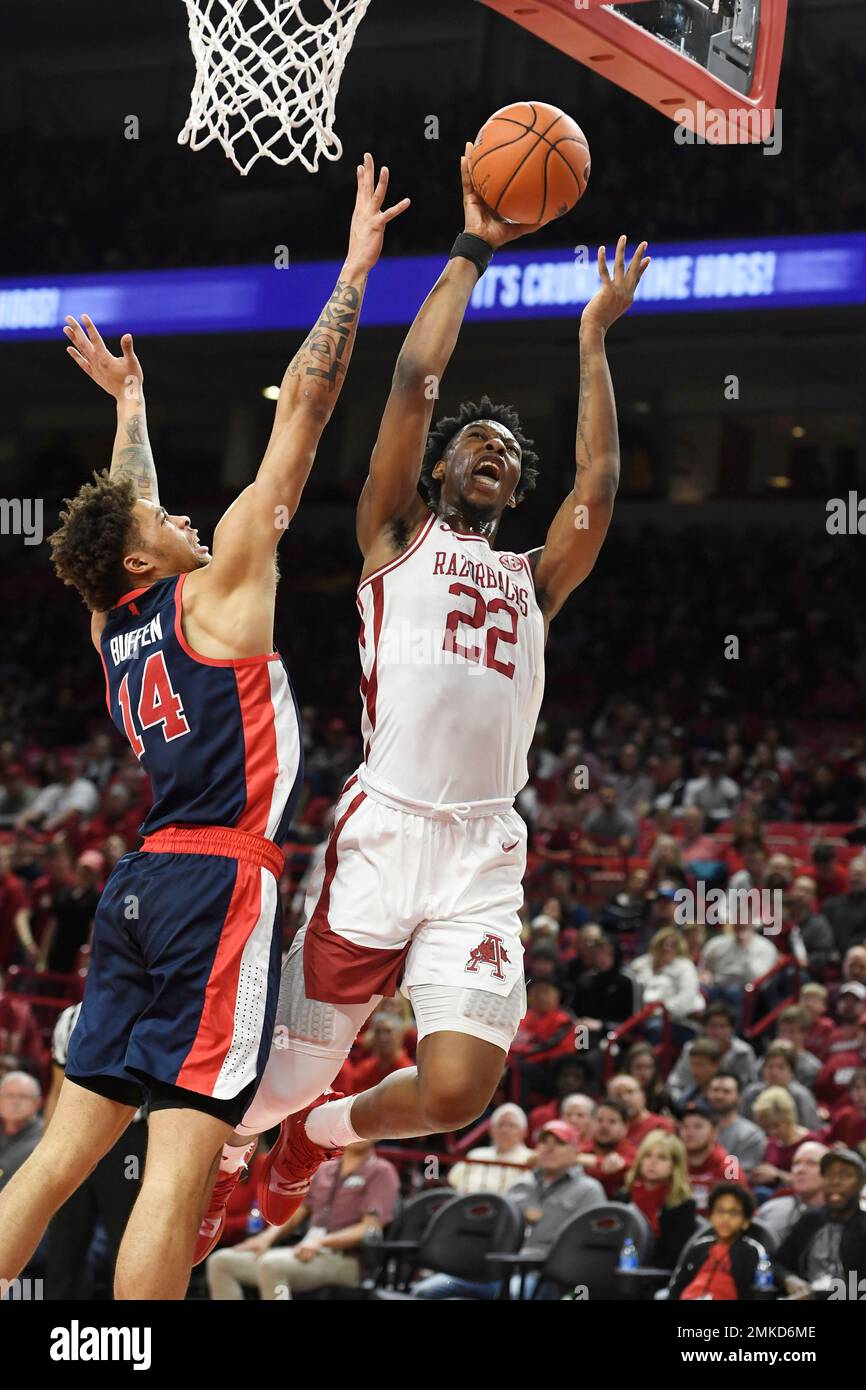 Arkansas forward Gabe Osabuohien (22) drives to the hoop against ...