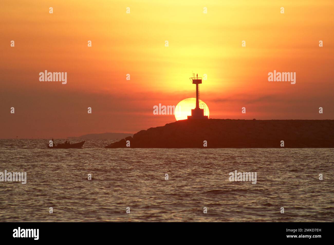 Landscape view, lighthouse with beautiful sunset and the ocean ...