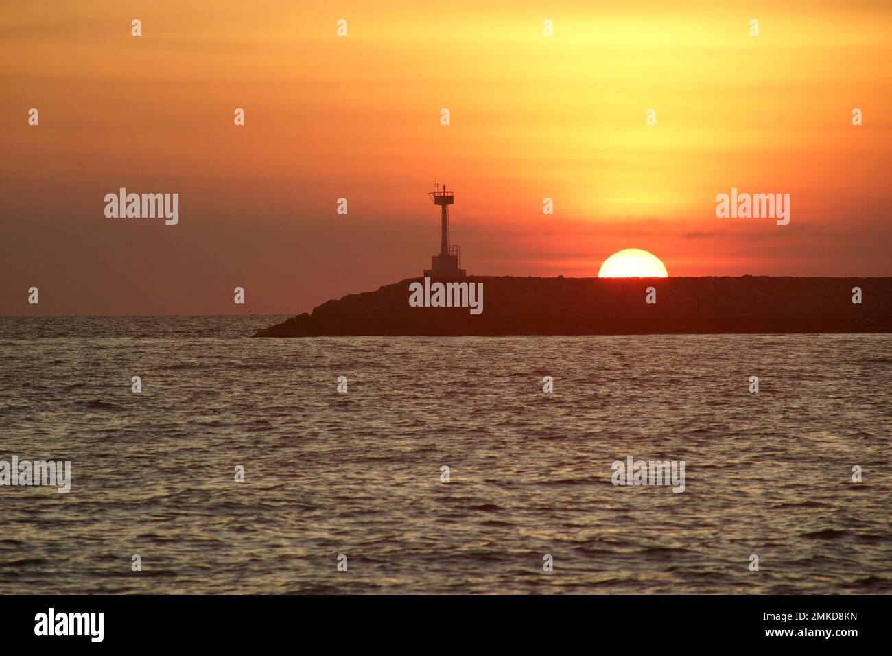 Landscape view, lighthouse with beautiful sunset and the ocean ...