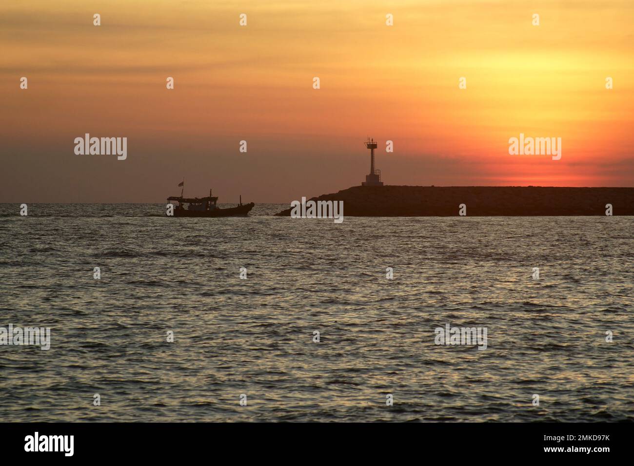 Landscape view, lighthouse with beautiful sunset and the ocean ...