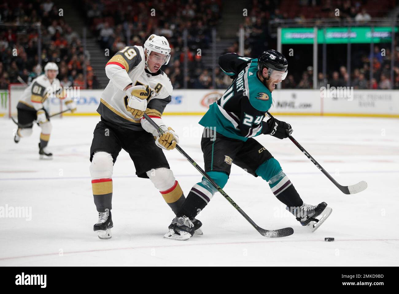 Anaheim Ducks' Carter Rowney, right, is pressured by Vegas Golden ...