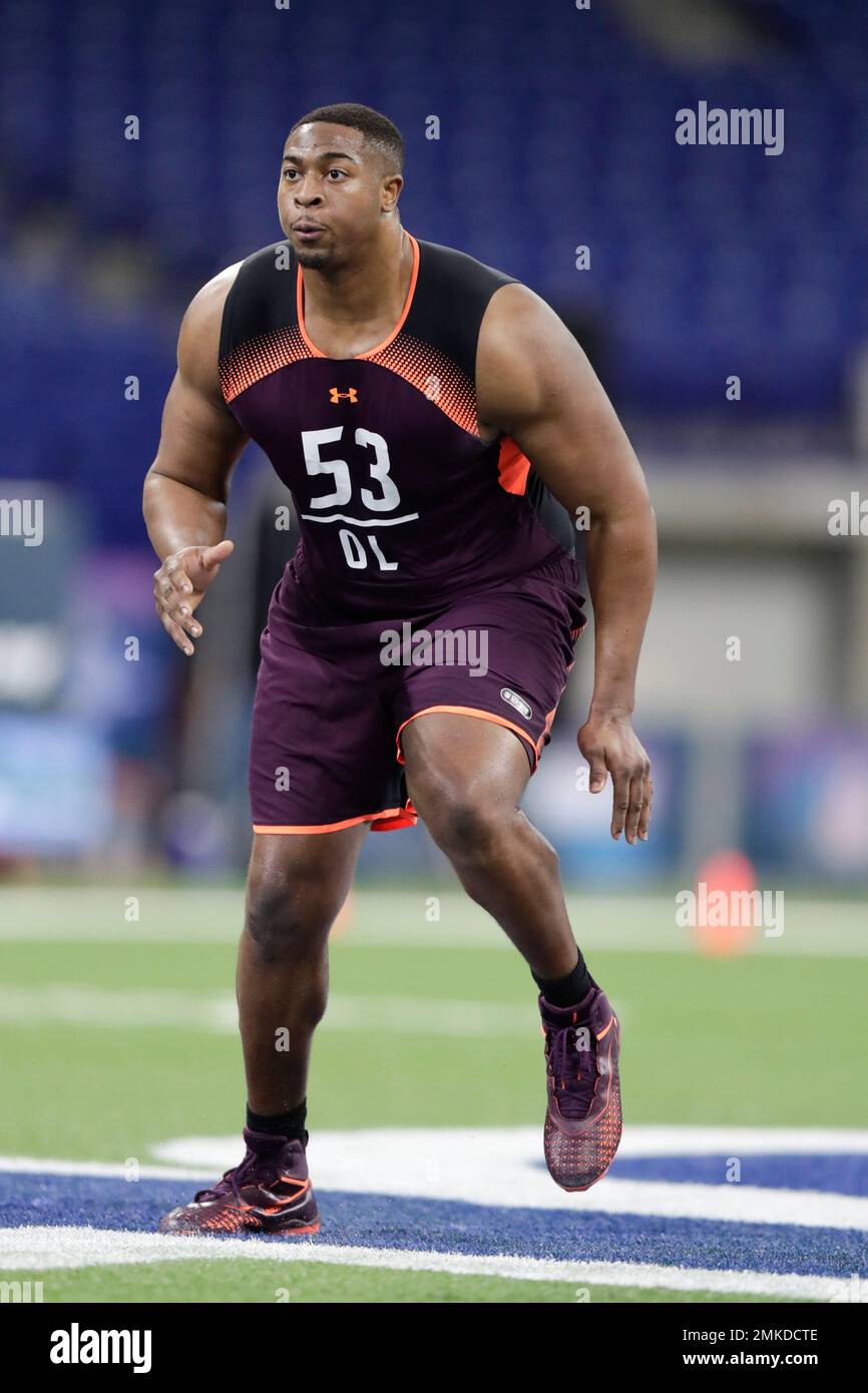North Carolina offensive lineman William Sweet runs a drill at the NFL ...