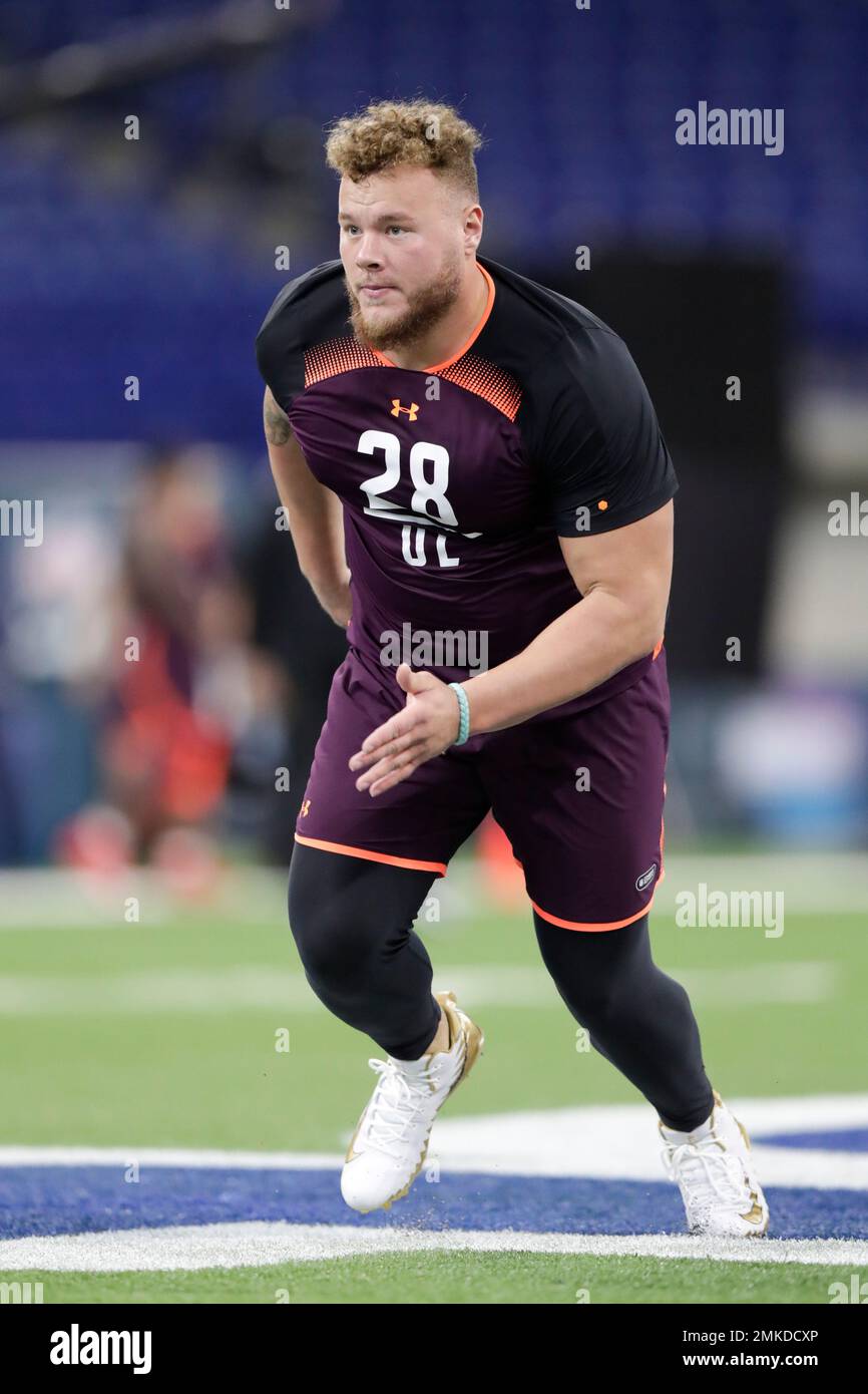 UCLA offensive lineman Andre James runs a drill at the NFL football ...