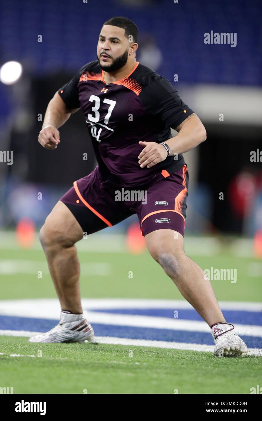 Texas A&M offensive lineman Erik McCoy runs a drill at the NFL football ...