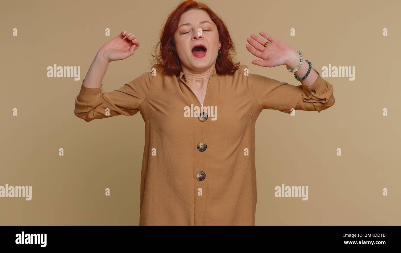 Tired redhead woman yawning, sleepy inattentive feeling somnolent lazy ...