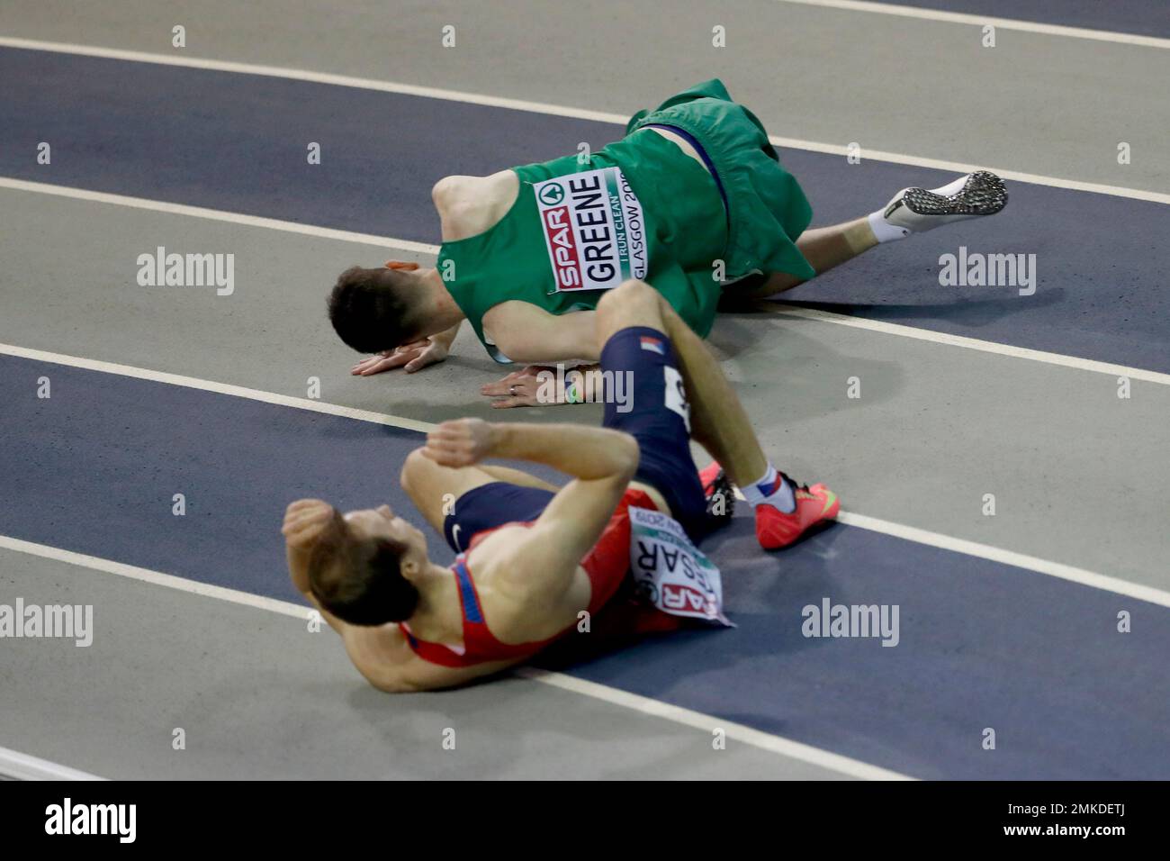 Ireland's Cillin Greene, top, and Czech Republic's Jan Tesar fall in ...