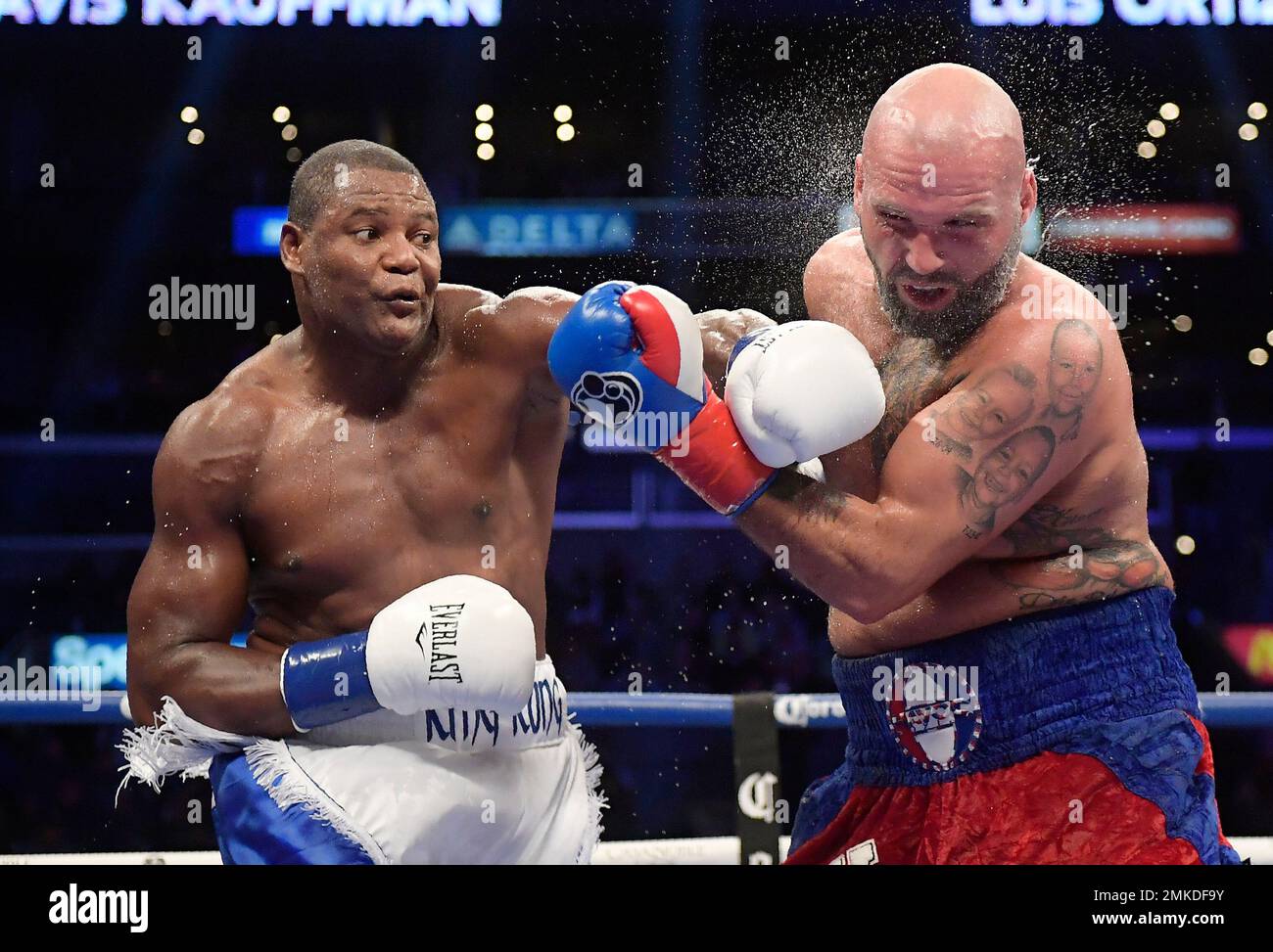 FILE - In this Dec. 1, 2018, file photo, Luis Ortiz, left, hits Travis ...