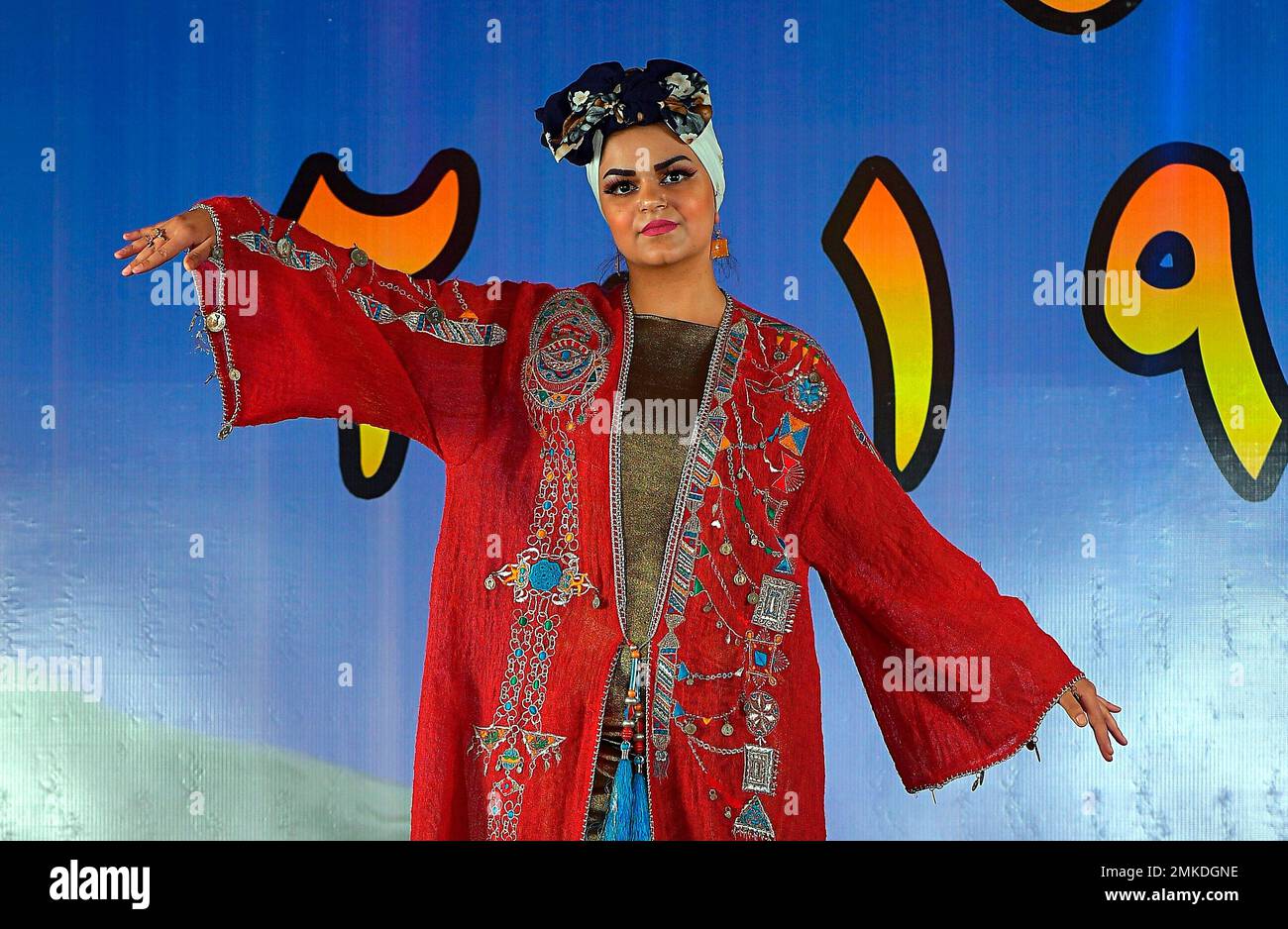 A model dressed in a traditional Iraqi folk costume walks the catwalk ...
