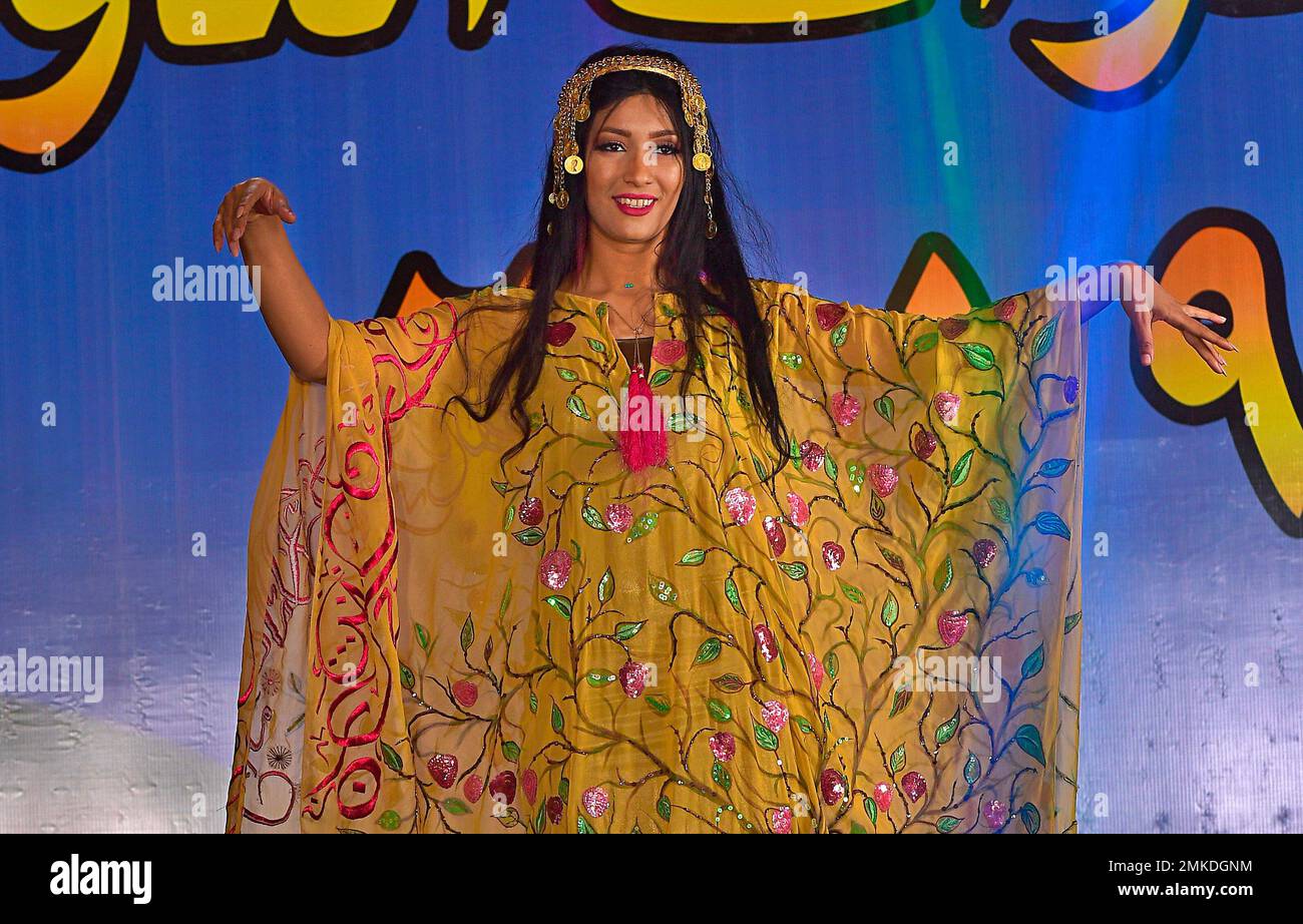 A model dressed in a traditional Iraqi folk costume walks on the ...