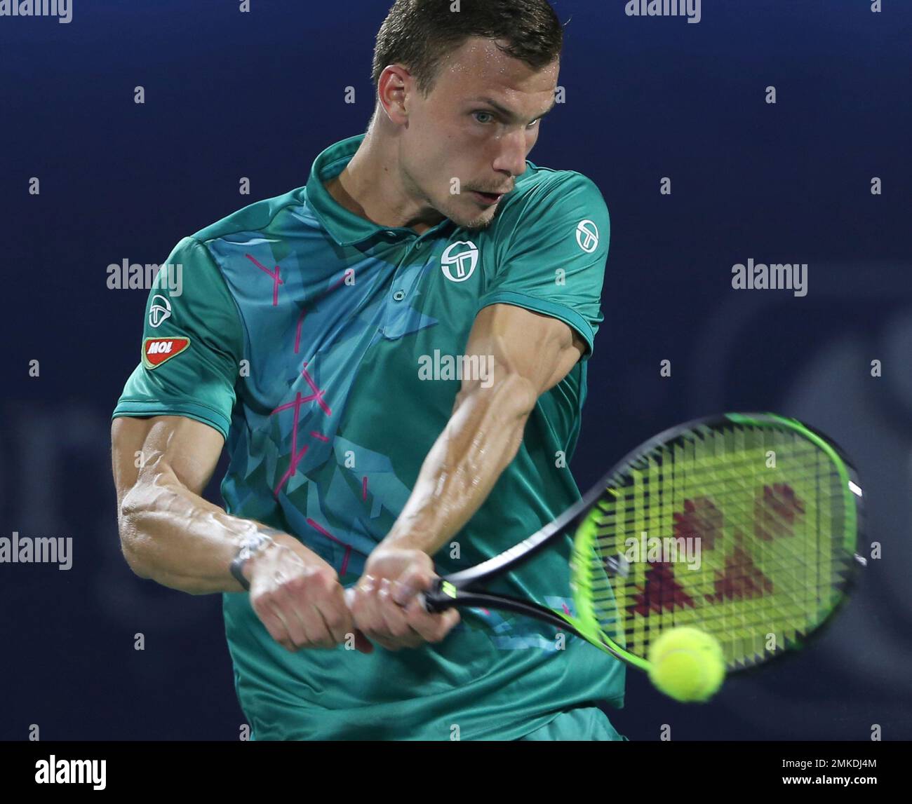 Marton Fucsovics of Hungry returns the ball to Roger Federer of ...