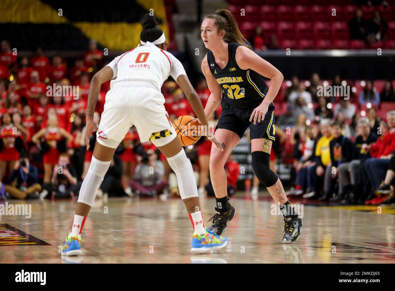 Maryland guard Shyanne Sellers (0) guards Michigan guard Leigha Brown ...