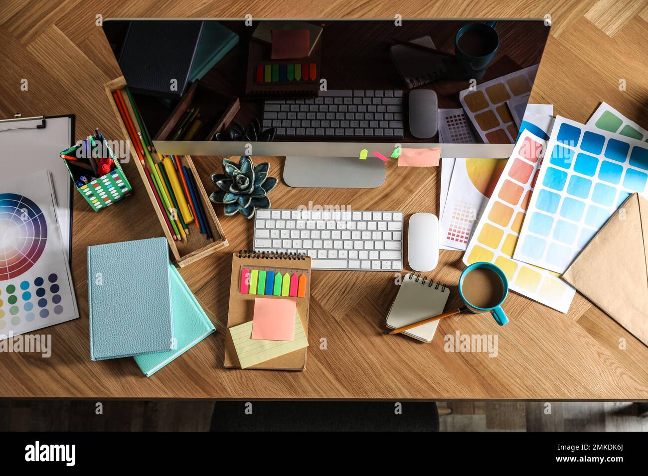 Designer's workplace with modern computer and color palettes, flat lay ...