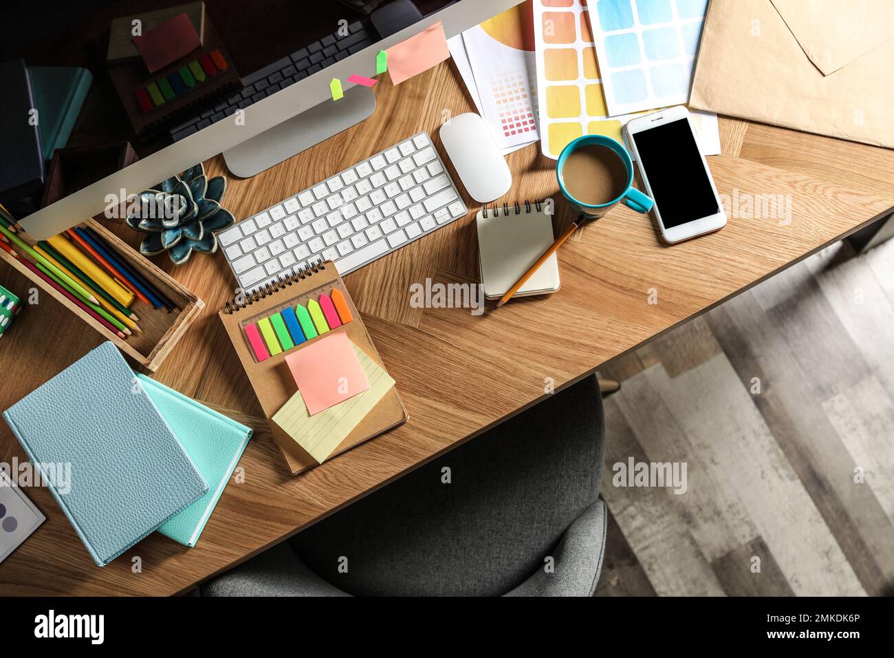 Designer's workplace with modern computer and color palettes, flat lay ...