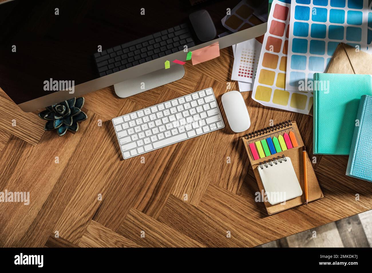 Designer's workplace with modern computer and color palettes, flat lay ...