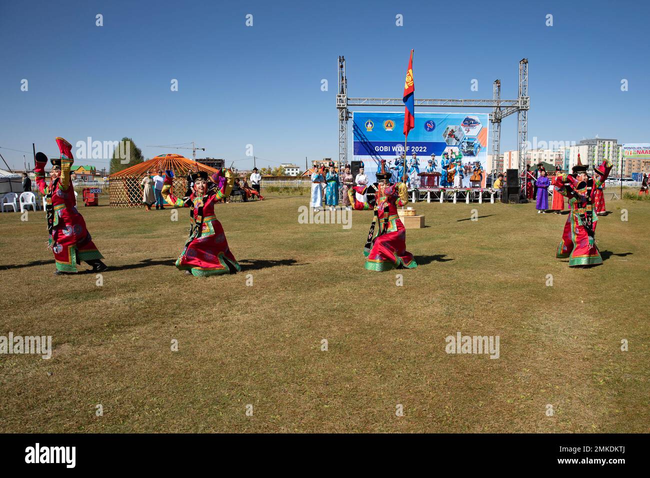 Mongolian performers in traditional dress, known as a Deel, dance for ...