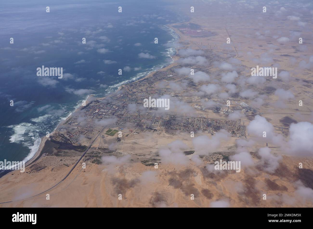 The Namibian coastline, desert and ocean through the clouds Stock Photo ...