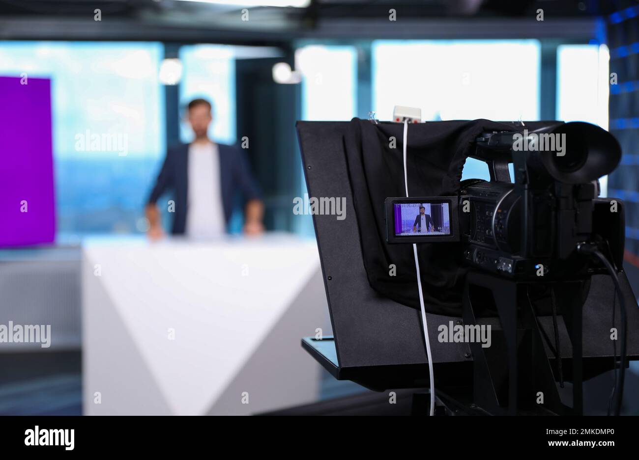 Presenter working in studio, focus on video camera Stock Photo - Alamy