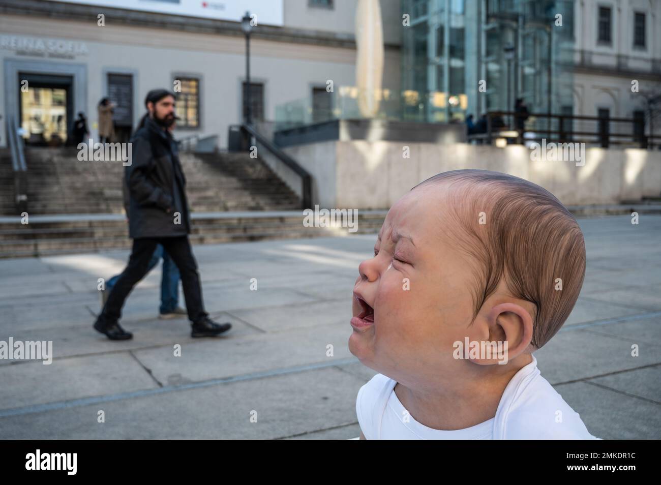 Madrid, Spain. 28th Jan, 2023. People walk past by an hyperrealistic ...