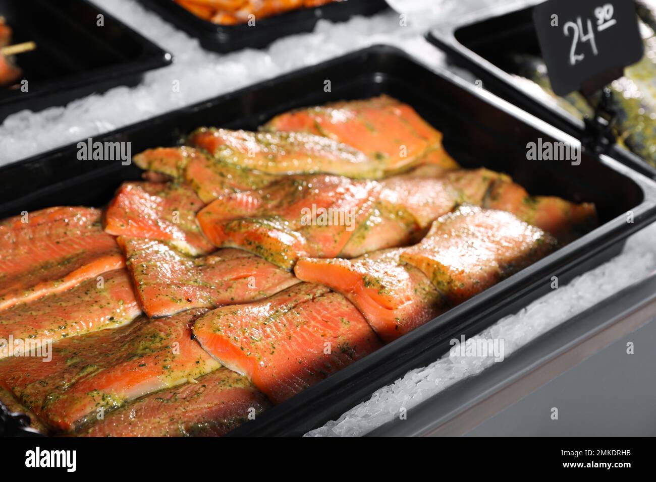Fresh marinated fish in container on display, closeup Stock Photo - Alamy
