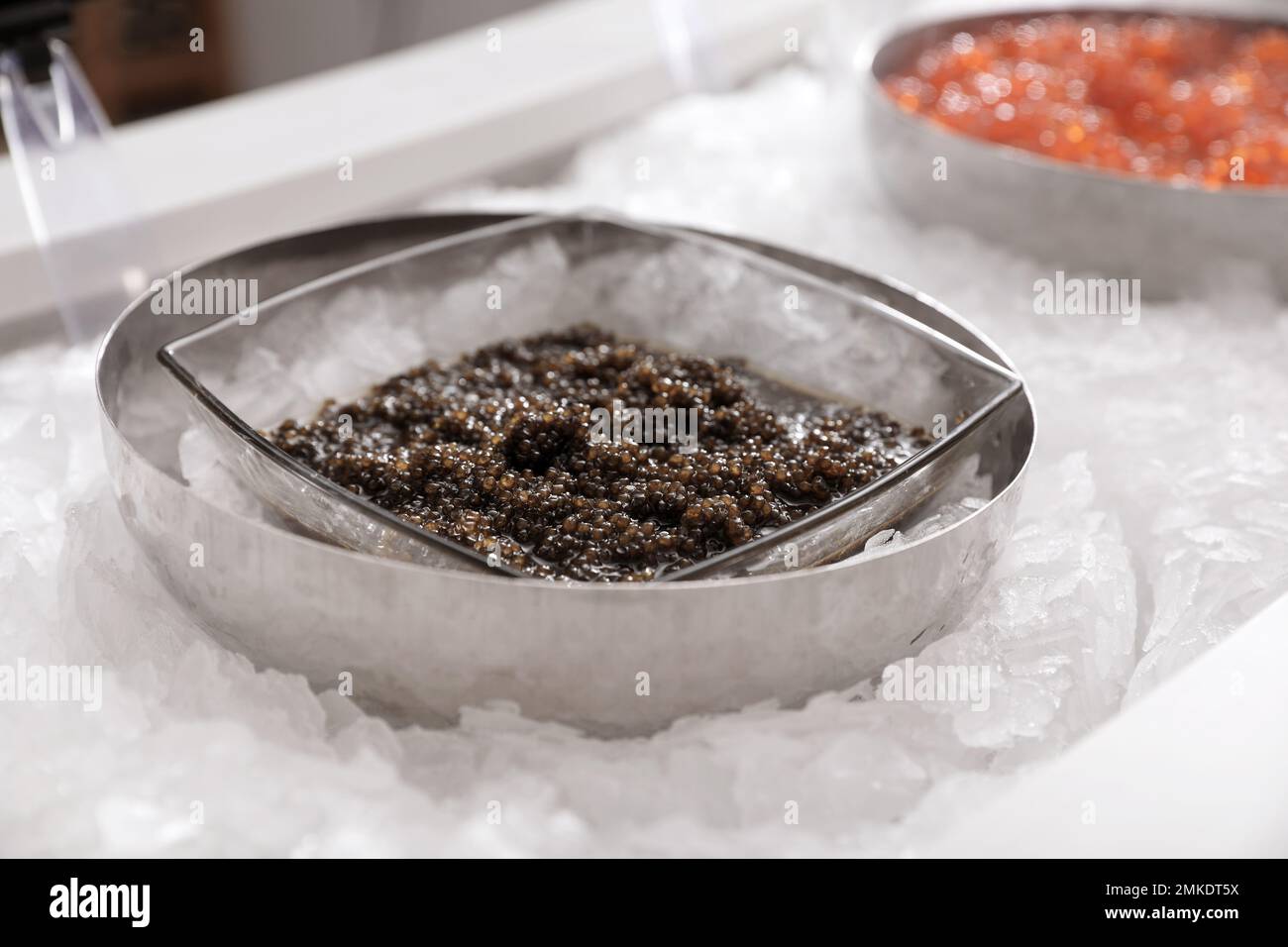 Delicious black caviar on ice. Wholesale market Stock Photo - Alamy