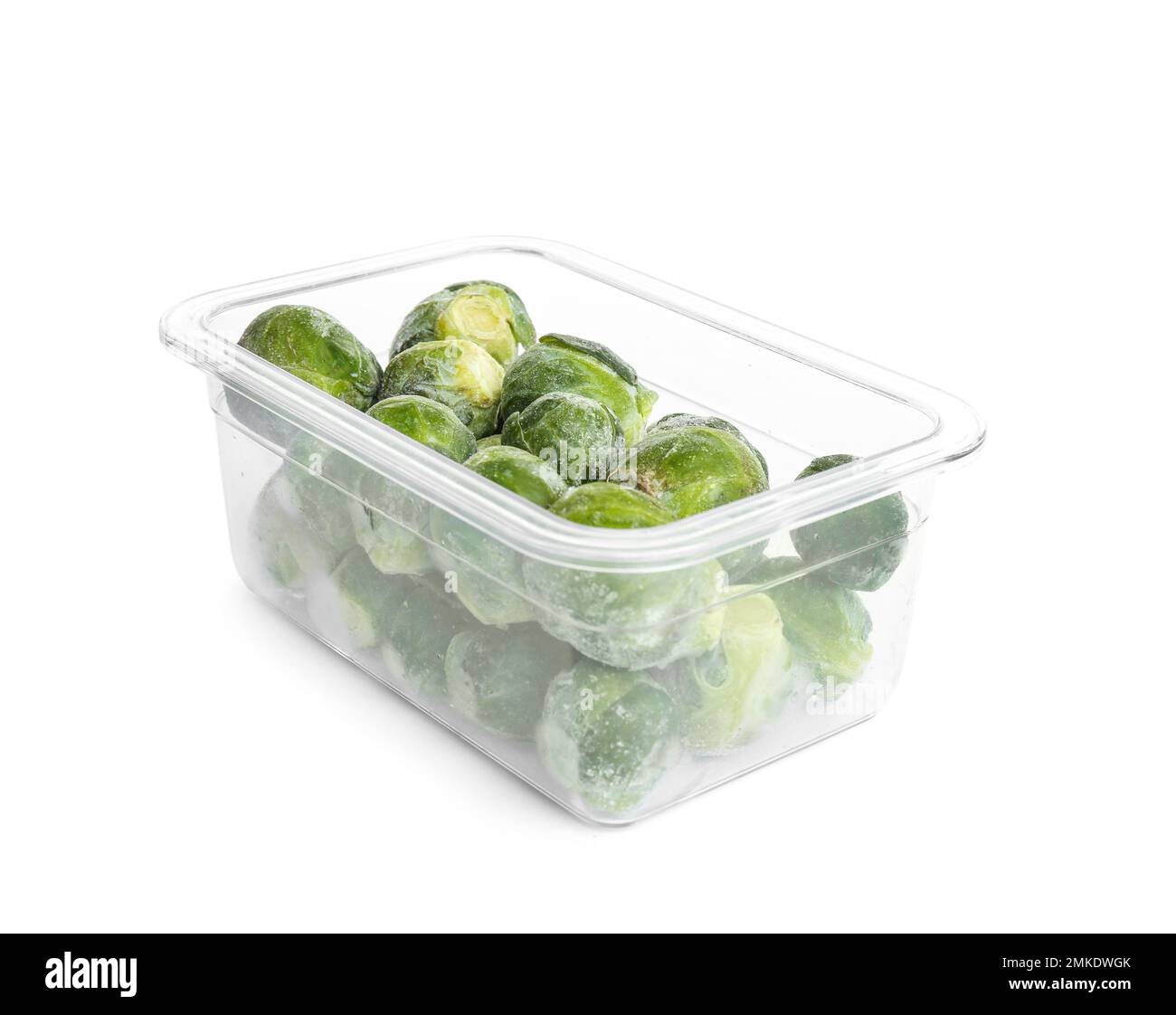 Frozen Brussels sprouts in plastic container isolated on white ...