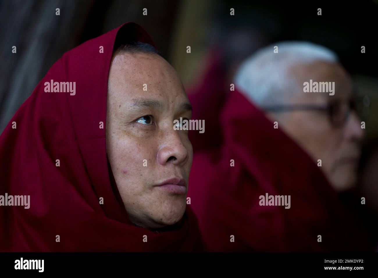 Exile Tibetan Buddhist monks look at their spiritual leader the Dalai ...