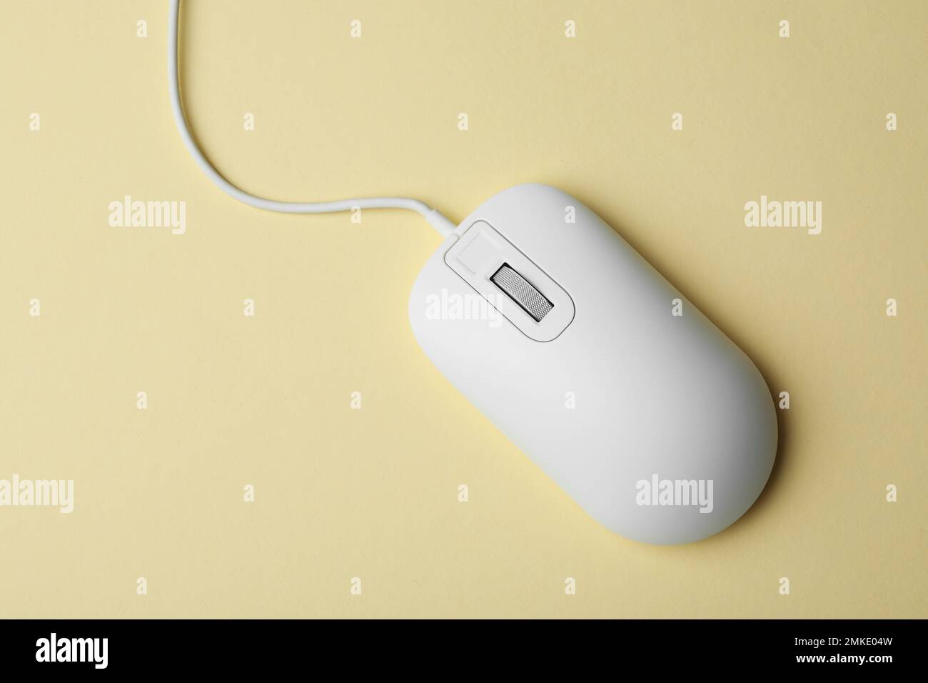 Wired computer mouse on yellow background, top view Stock Photo - Alamy