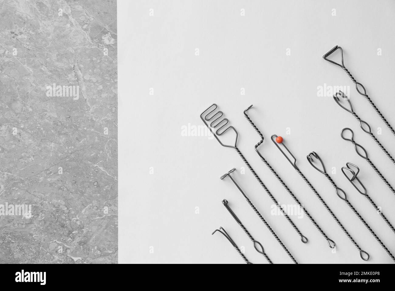 Set of logopedic probes on table, top view. Speech therapist's tools ...