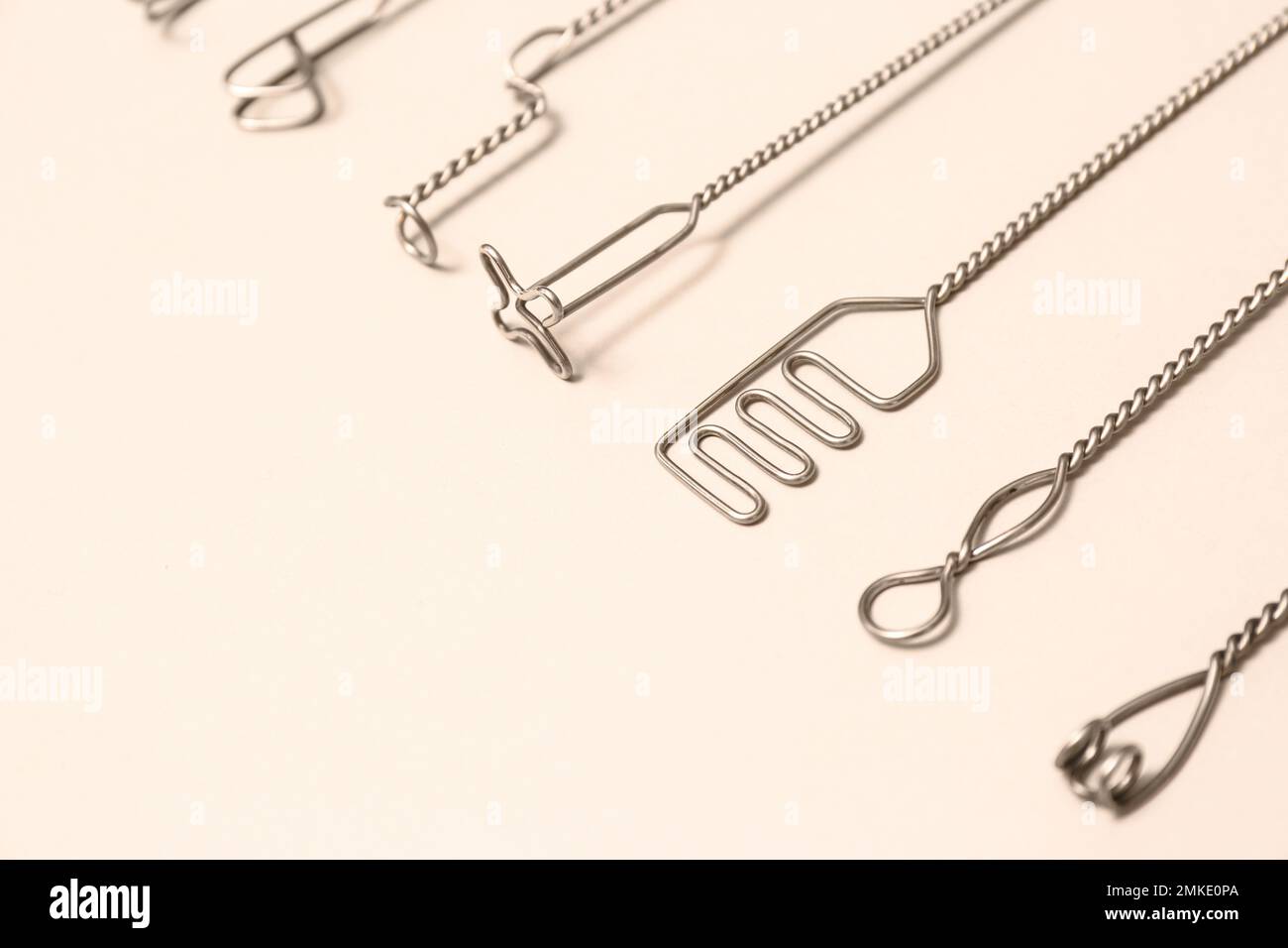 Set of logopedic probes for speech therapy on beige background. Space ...