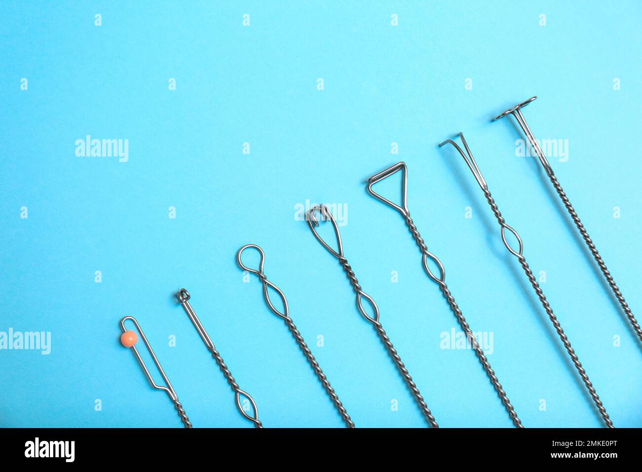 Set of logopedic probes for speech therapy on light blue background ...