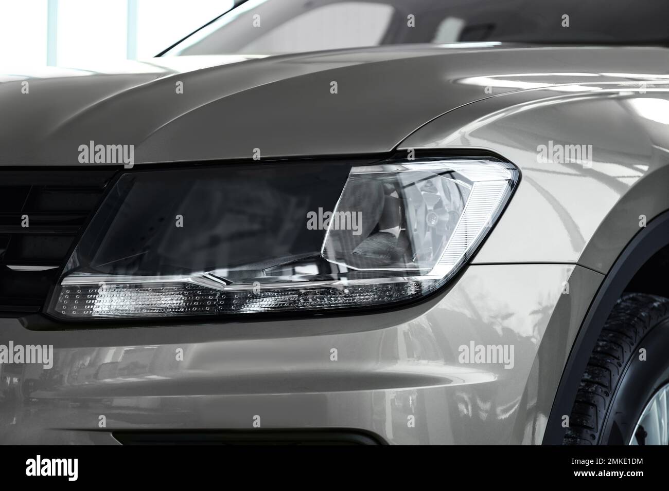 New luxury car in modern auto dealership, closeup Stock Photo - Alamy