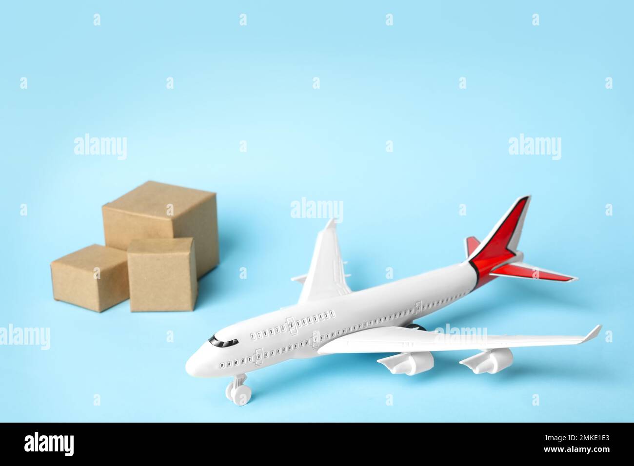 Toy plane on blue background. Logistics and wholesale concept Stock ...