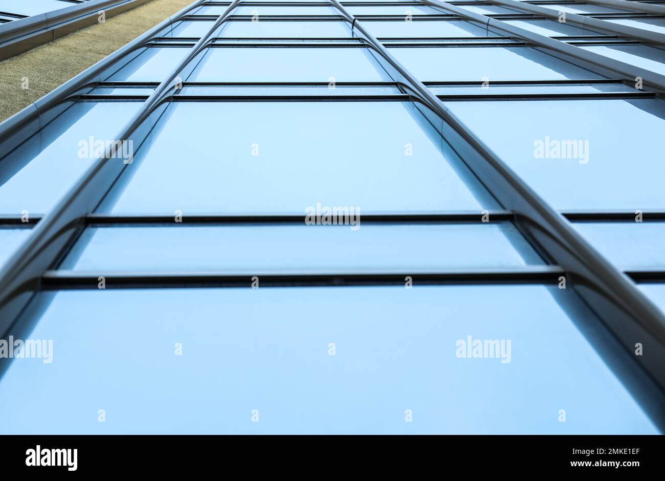 Modern building with tinted windows, low angle view Stock Photo - Alamy