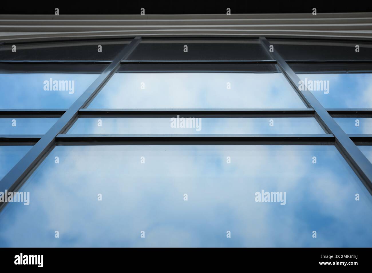 Modern building with tinted windows, low angle view. Urban architecture ...