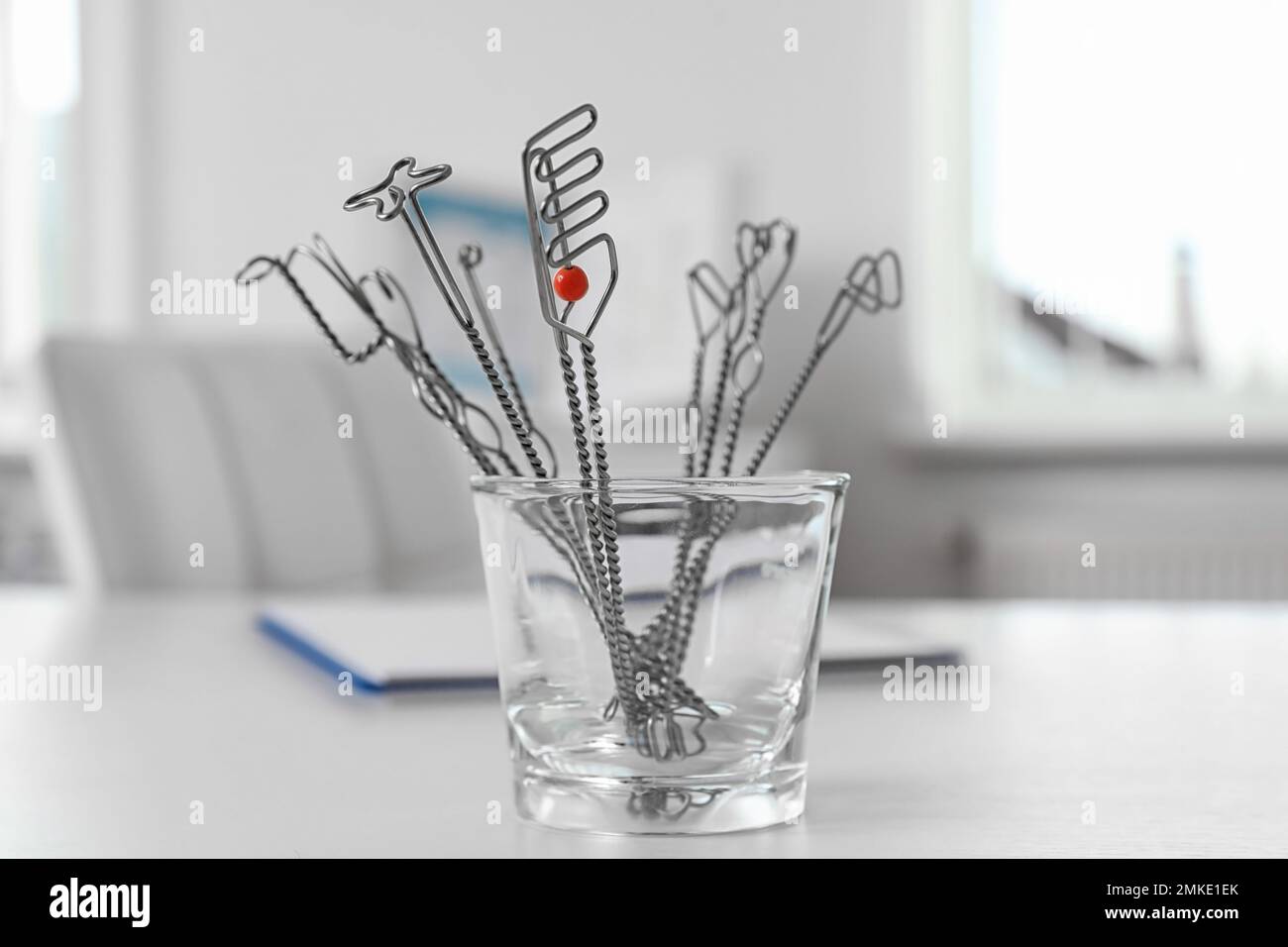 Set of different logopedic probes in holder on light table. Speech ...